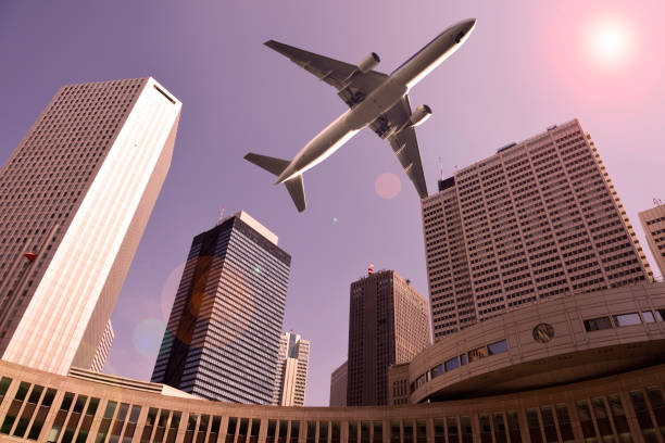 Free Stock Photo of Airplane Flying Over Building With Sky Background ...
