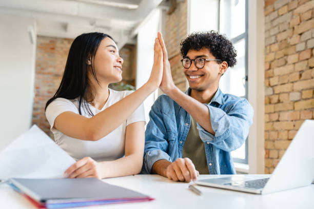 Free Stock Photo of Happy coworkers giving high five in the office ...