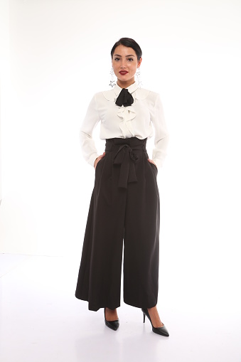 Young Beautiful Business Woman In Black Skirt White Shirt And Glasses Front Of White Background