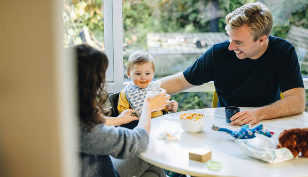 Free Stock Photo of Dad feeding his distracted son | Download Free ...