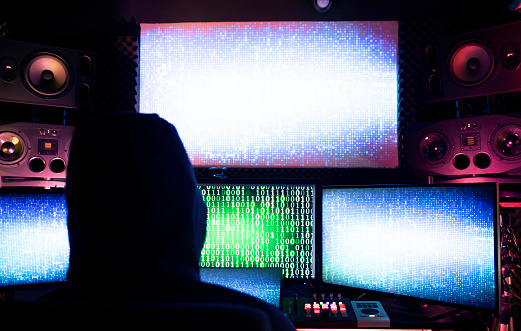 Hacking And Malware Concept Hacker Using Abstract Laptop With Binary Code Digital Interface