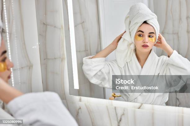 Beautiful Woman With Eye Patches In White Bathrobes In Bathroom Stock