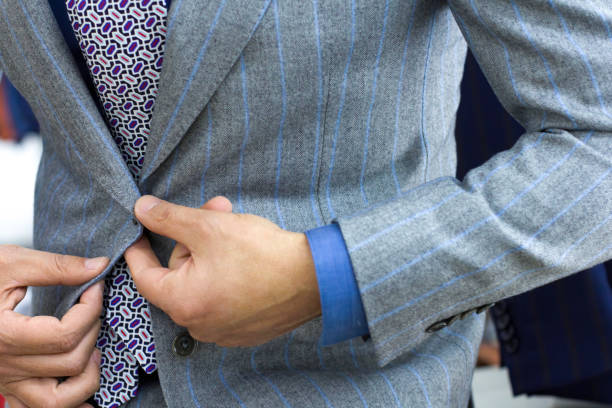 Free Stock Photo of A close up of a man s hands buttoning a jacket ...