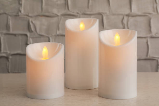 Free picture: Artificial white candles with fake flames on a table at ...