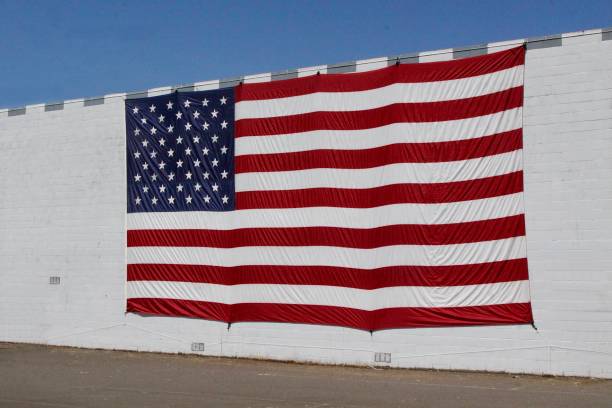 Free Stock Photo of Large American Flag Displayed on Side of Building ...