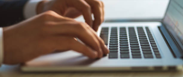Free Stock Photo of Hands typing on laptop keyboard - fuzzy looks ...