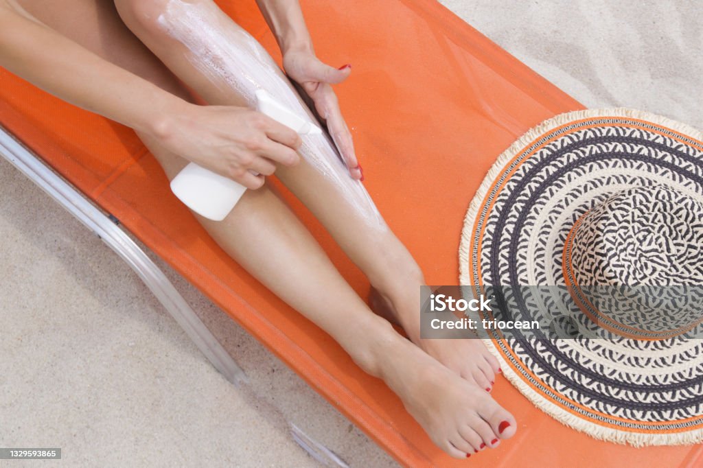 Woman Applying Sunscreen Cream On Her Legs Sun Protection Skin Care