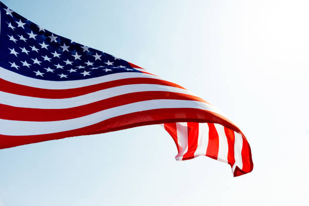 Free Stock Photo of The American Flag Flying High in the Sky | Download ...