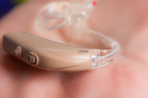 Senior Person Holding Hearing Aid Closeup Stock Photo - Download Image ... Senior Person Holding Hearing Aid Closeup Stock Photo - Download Image ...