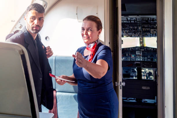 Free Stock Photo of Flight attendant speaking through a loudspeaker to ...