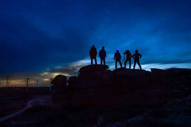 Free Stock Photo of Group of People Standing Outside Building at Night ...