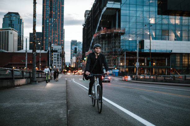 Free Stock Photo of Man Riding Bike Down Street at Night | Download ...