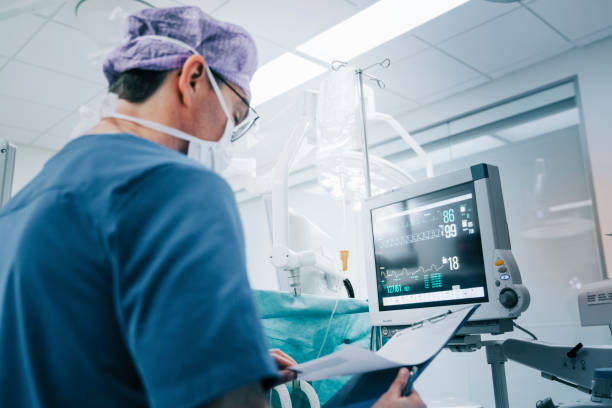Free Stock Photo of Medical Professional in Scrubs and Mask Operating ...