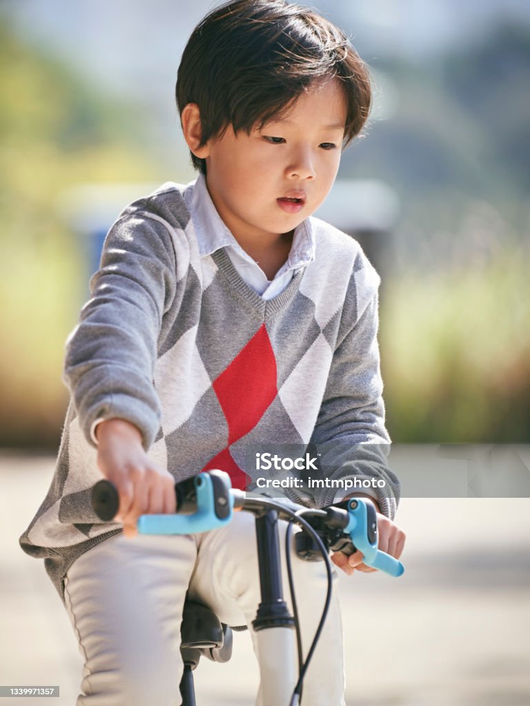 Little Asian Boy Riding Bike Outdoors Stock Photo - Download Image Now ... Little Asian Boy Riding Bike Outdoors Stock Photo - Download Image Now ...