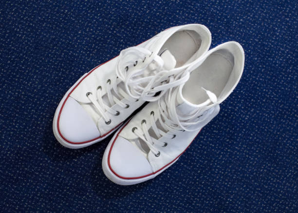 Free picture: Pair of black and white Converse sneakers on the ground