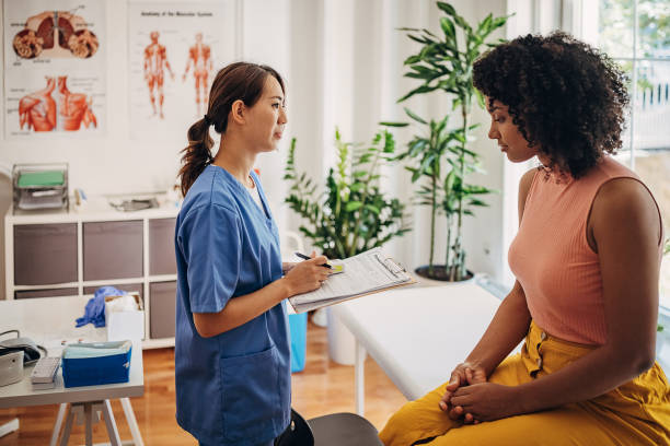 Free Stock Photo of Doctor doing physical examination of young female ...