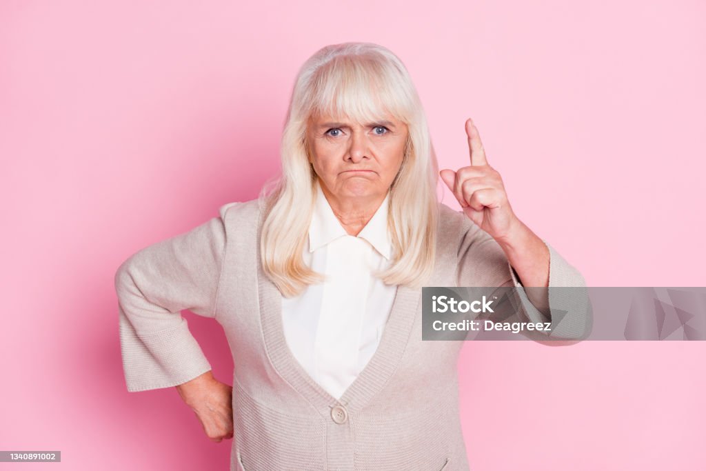Photo Of Strict Retired Woman Pointing Finger Forbid Wear Beige
