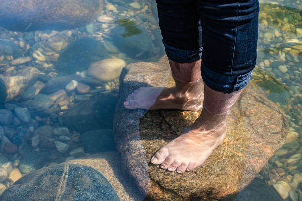 Free picture: Man’s bare feet on big stone in rocky river