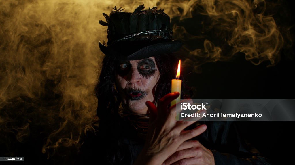Sinister Old Mature Woman In Carnival Costume Of Halloween Witch Making