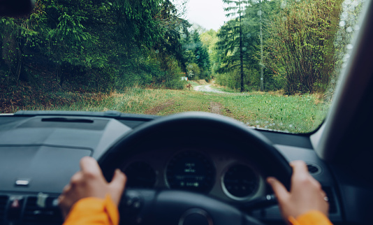 Driver Dressed Bright Orange Jacket Driving A Modern Off Road Right