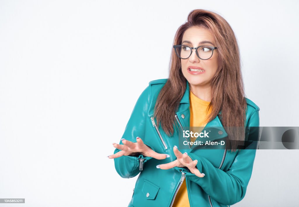Dissatisfied Young Woman Has Disgusting Expression On Face Wearing ... Dissatisfied Young Woman Has Disgusting Expression On Face Wearing ...