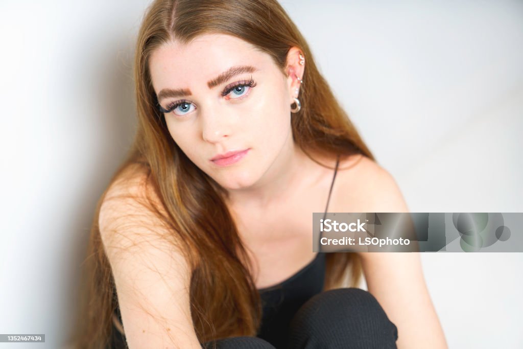 Portrait Of Young Beautiful And Cheerful Girl Looking At Camera Over