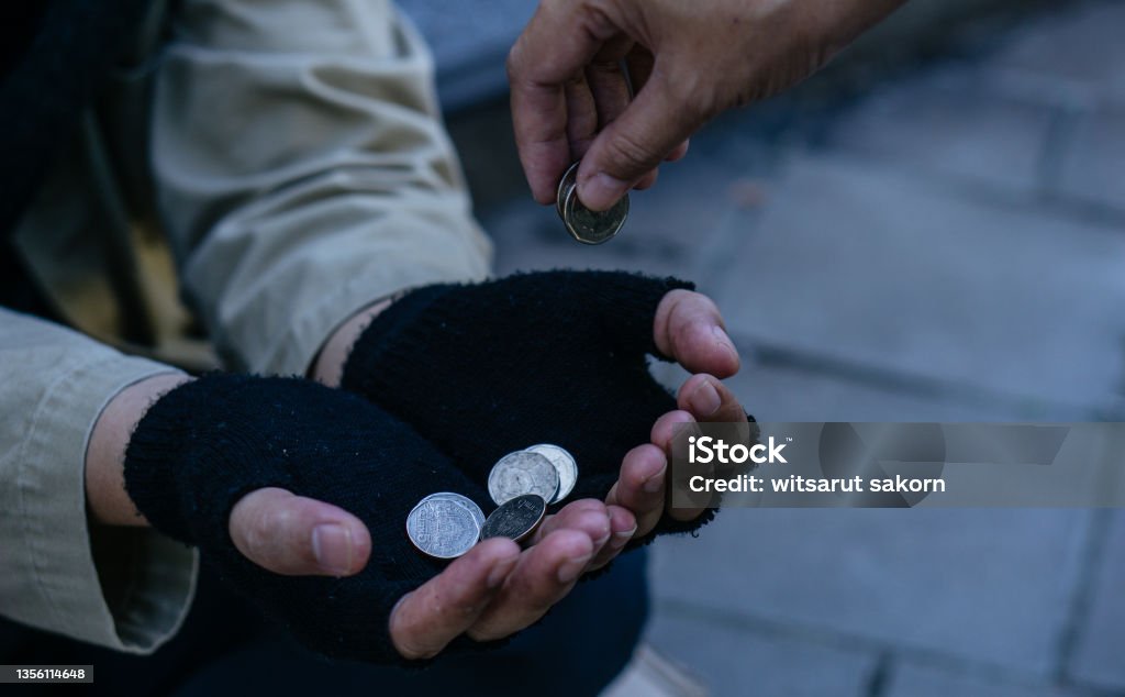 Woman Giving Money To Homeless Beggar Man Sitting In Citygiving Concept