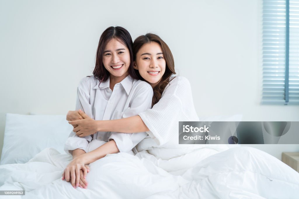 Portrait Of Asian Beautiful Lesbian Couple Hugging And Look At Camera