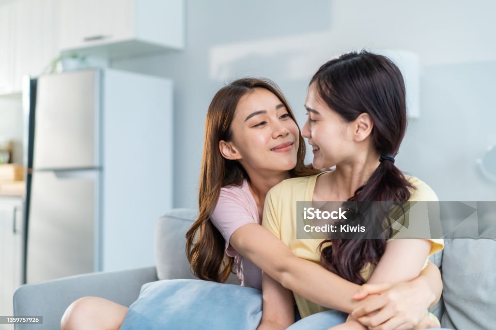 Asian Beautiful Lesbian Women Couple Hugging Girlfriend In Living Room