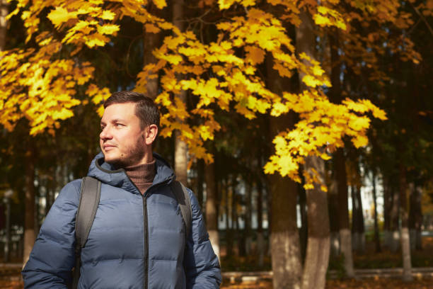 Free Stock Photo of Man in Yellow Jacket Standing in Front of Tree ...