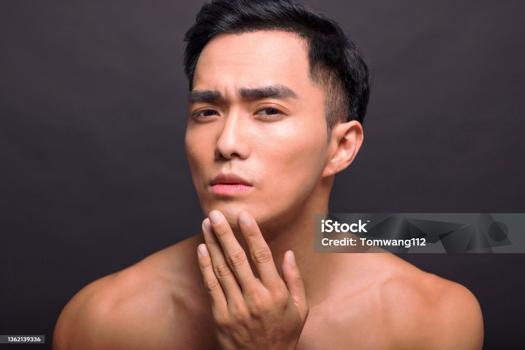 Close Up Of Satisfied Confident Handsome Guy Touching With Shaved Flawless Clean Soft Skin Stock