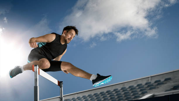 Free Stock Photo of Man in Blue Uniform Jumping Over Hurdle | Download ...