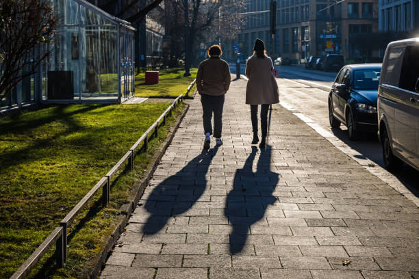 Free Stock Photo of Two people walking on the street at sunset ...