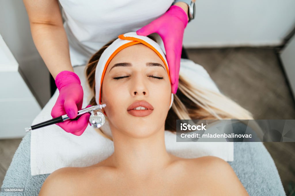 Young Woman Enjoying Skin Rejuvenation Therapy At Cosmetology Center