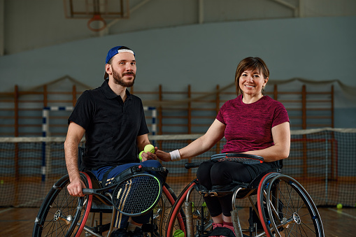 Pair Of Disabled Tennis Players Hugging Each Other Stock Photo ... Pair Of Disabled Tennis Players Hugging Each Other Stock Photo ...