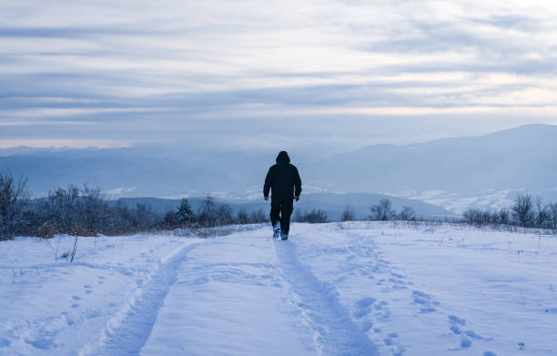 Free Stock Photo of Man Walking Across Snow Covered Slope | Download ...