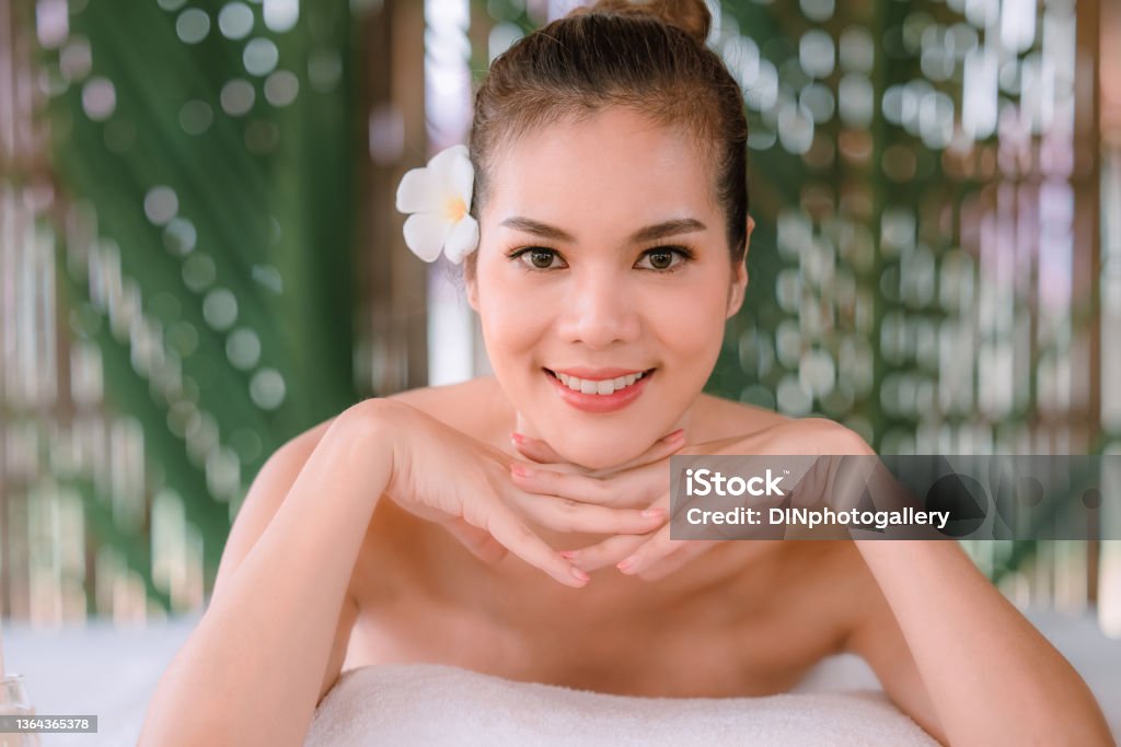 Beautiful Young Asian Woman Lying Relaxing In Spa Massage Salon Close
