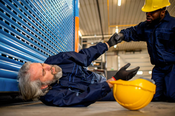 Free Stock Photo of Warehouse worker lying down on floor after accident ...