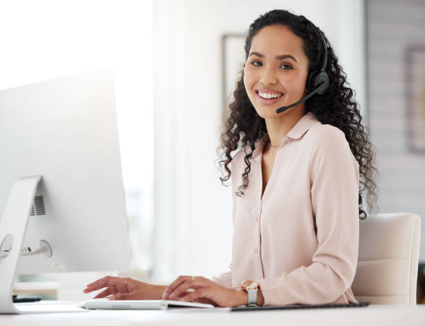 Free Stock Photo of Smiling female telemarketer standing while using a ...