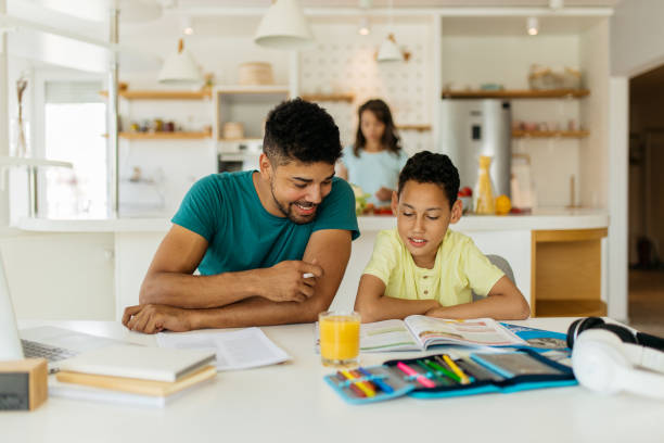 Free Stock Photo of Parents teaching and helping kids to do homework ...