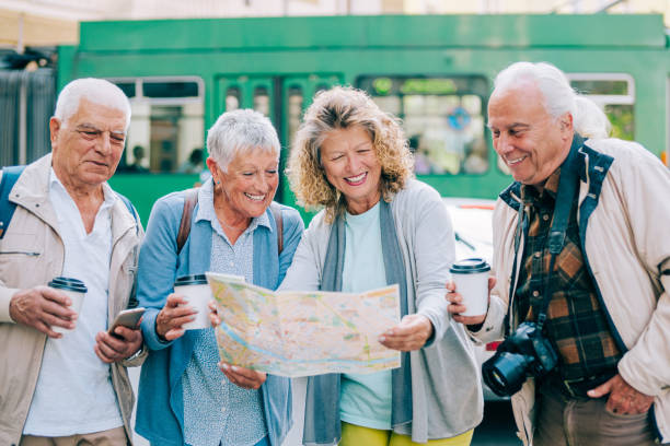 Free Stock Photo of A couple of elderly tourists visiting a city ...