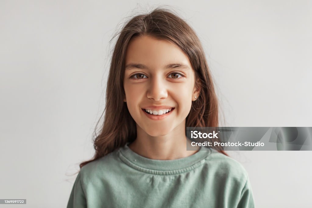 Headshot Of Happy Girl Smiling Looking At Camera Gray Background Stock