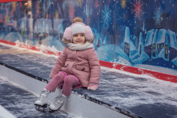 Free Stock Photo of A girl looking out a window at an ice rink ...