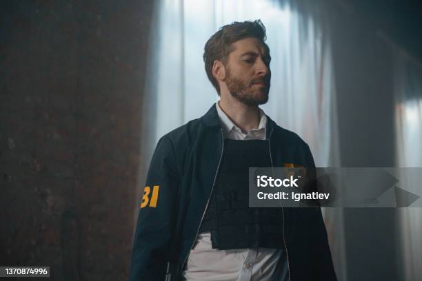 Handsome Fbi Agent At The Crime Scene Seriously Looking Down Standing