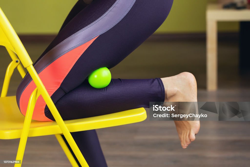 A Woman In Sportswear Performs Myofascial Relaxation Of The