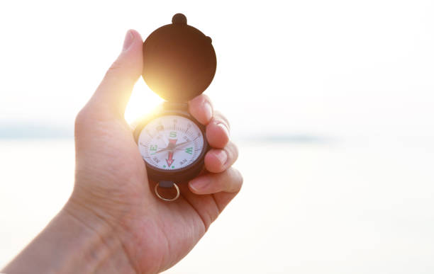 Free Stock Photo of A hand holding a compass on a mountain | Download ...