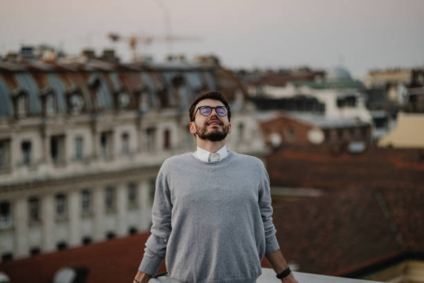Free Stock Photo of A young caucasian man on a rooftop walkway ...