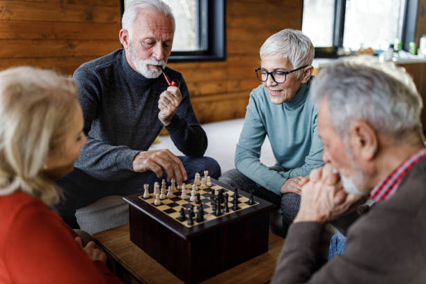 Free Stock Photo of Elderly couple playing a game of chess together ...