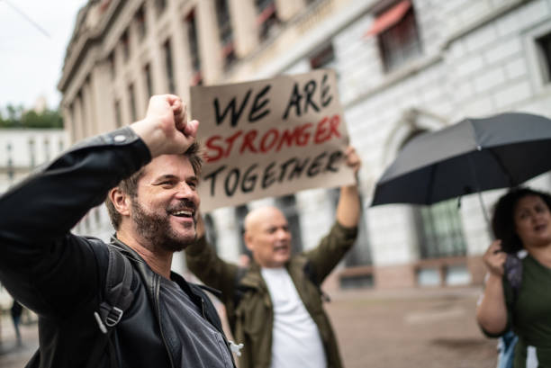 Free Stock Photo of Crowd of People Holding Up Signs and Hats ...