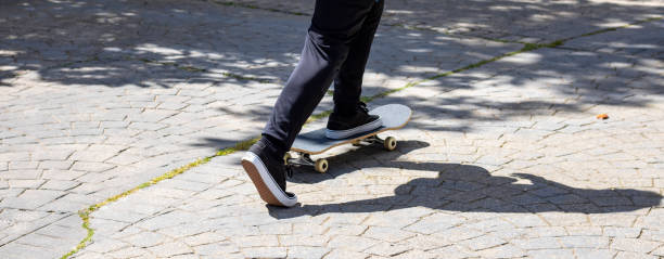 Free Stock Photo of Man Riding a Skateboard on Top of a Sidewalk ...